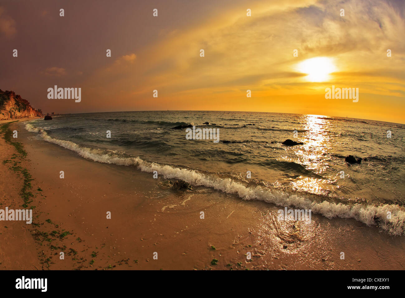The sunset on Mediterranean sea Stock Photo - Alamy