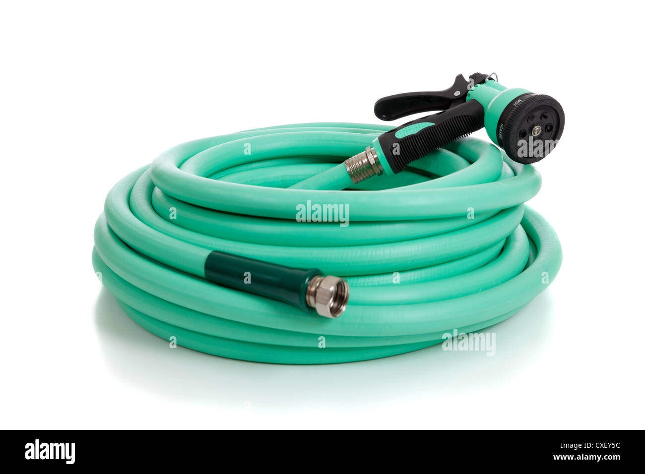Green garden hose on a white background Stock Photo - Alamy