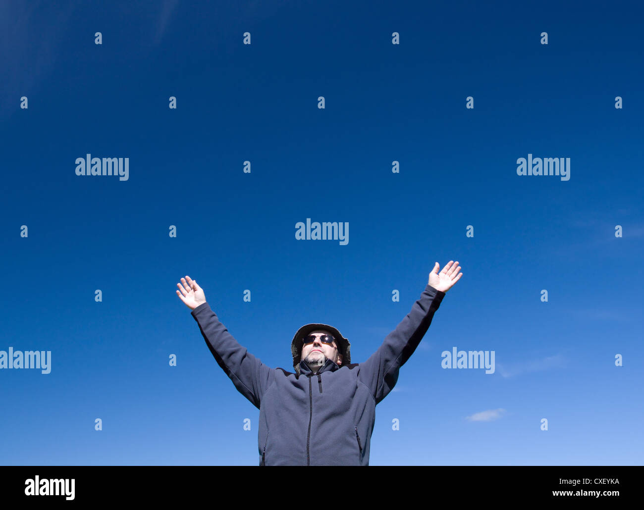 man on background blue sky Stock Photo - Alamy