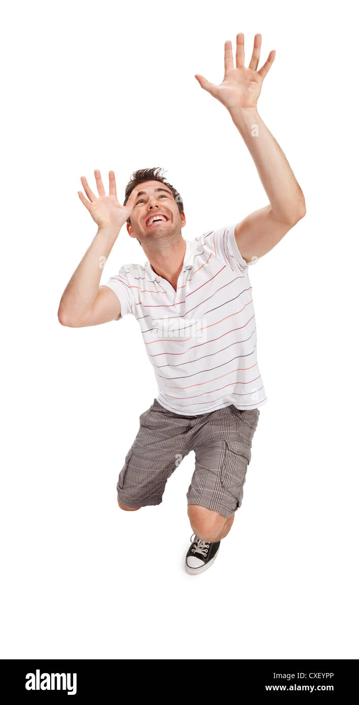 Portrait of young surprised man gesturing Stock Photo - Alamy