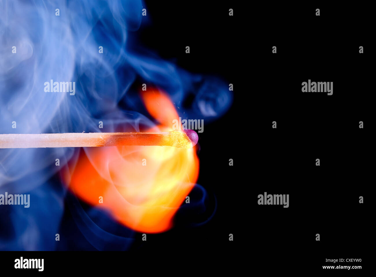 Burning match with blue smoke Stock Photo - Alamy