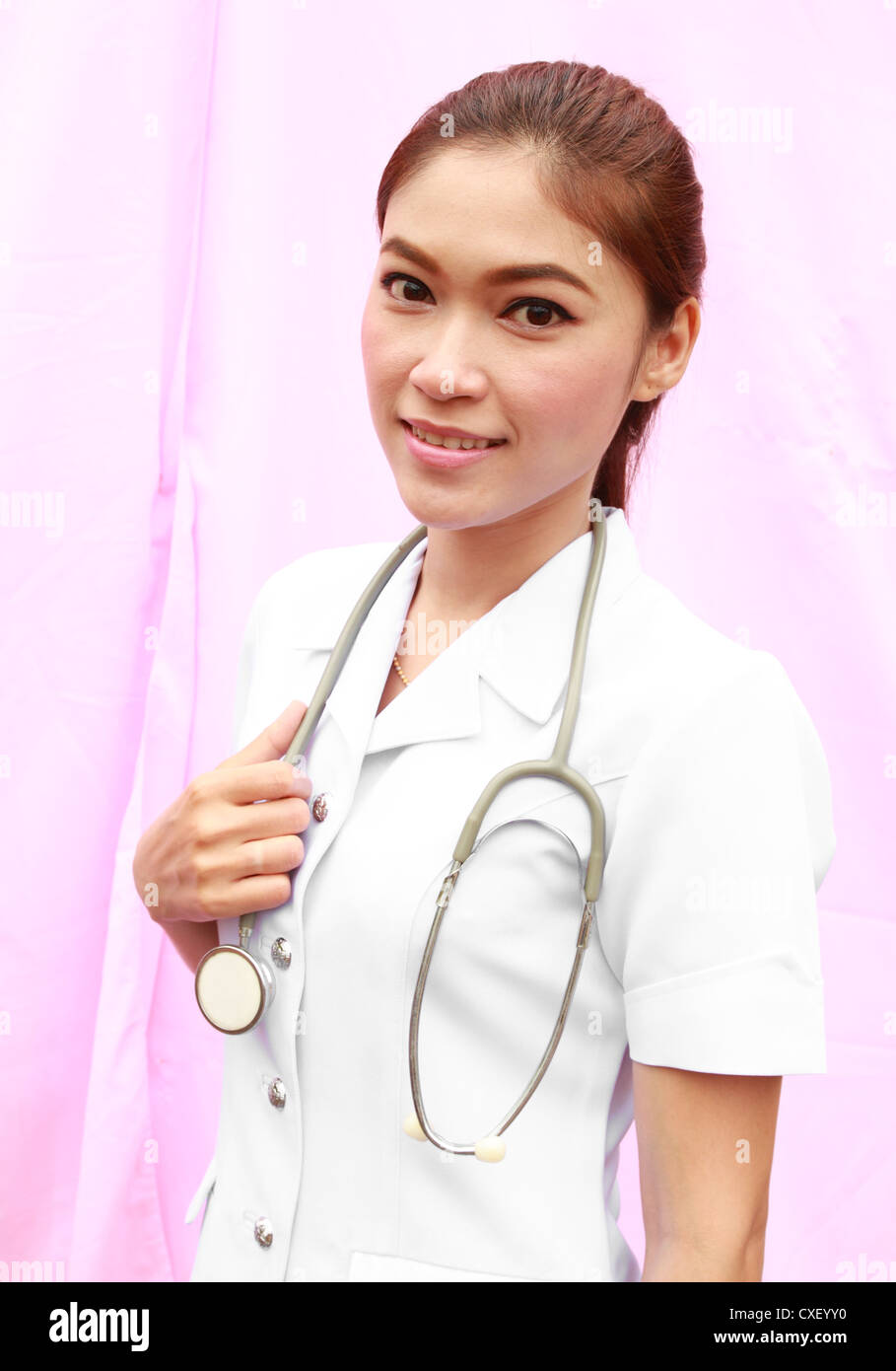 Female nurse standing with stethoscope Stock Photo - Alamy