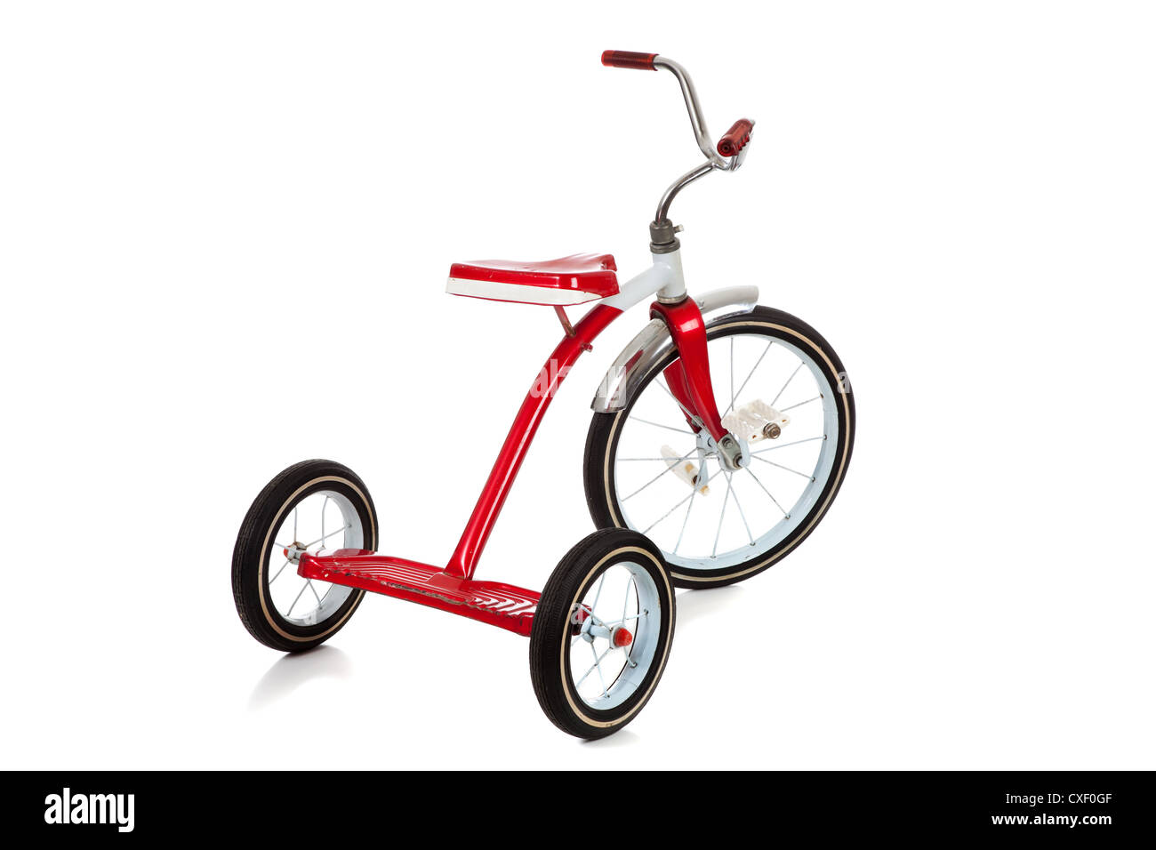 Red tricycle on a white background Stock Photo - Alamy