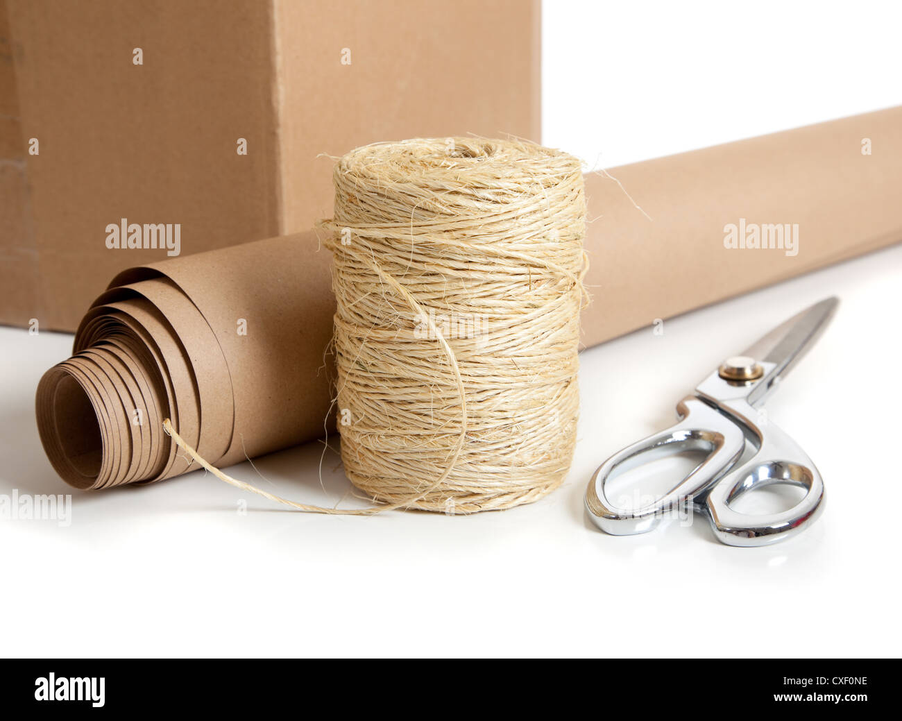 packing box with twine and scissors on a white background Stock Photo ...