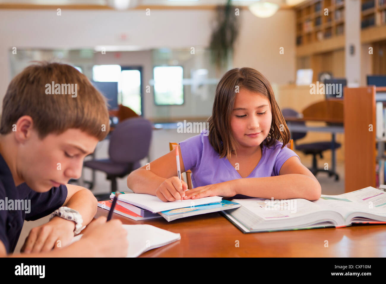 Students studying in library Stock Photo - Alamy