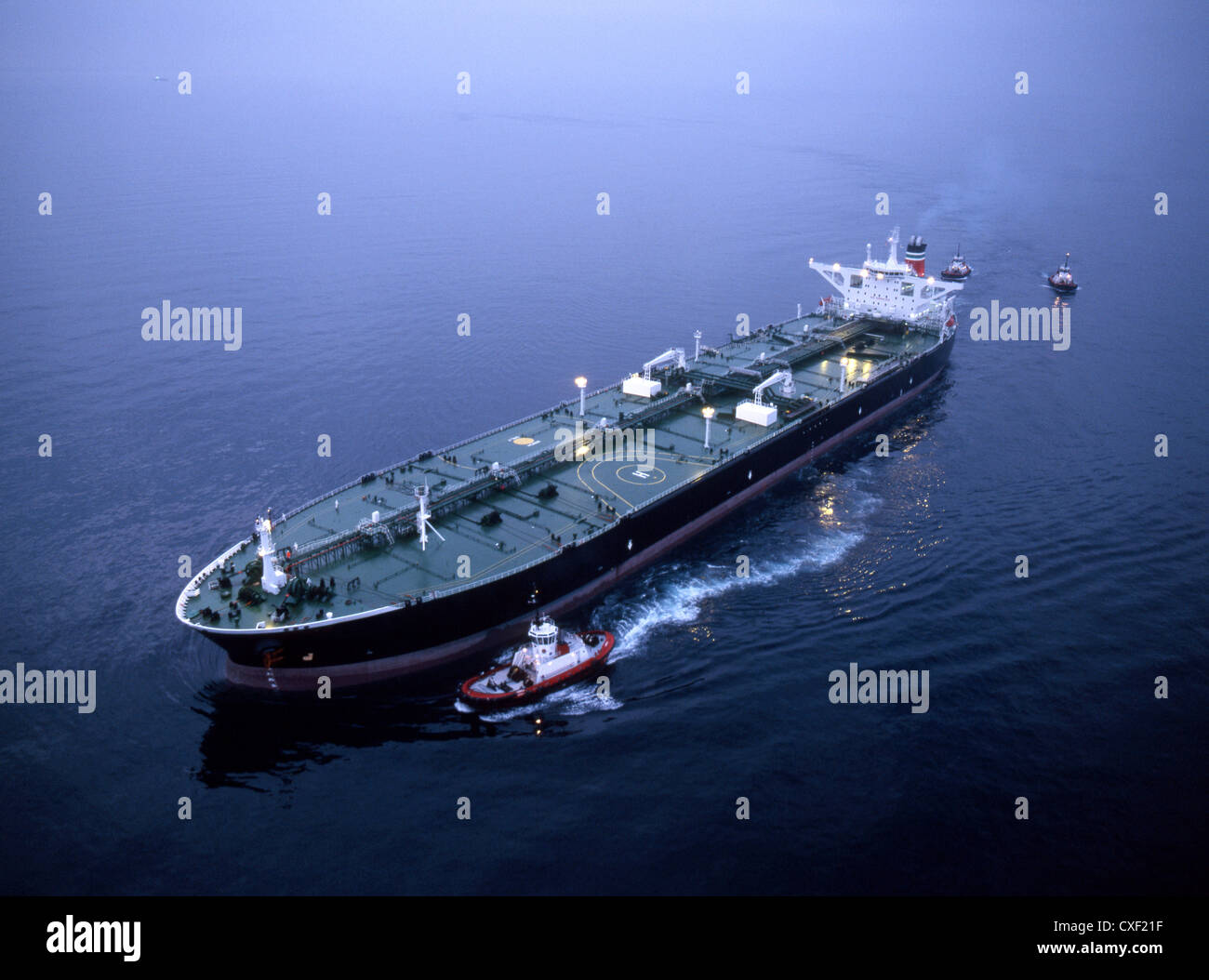 Tugboat and container ship in the port of Long Beach Stock Photo - Alamy