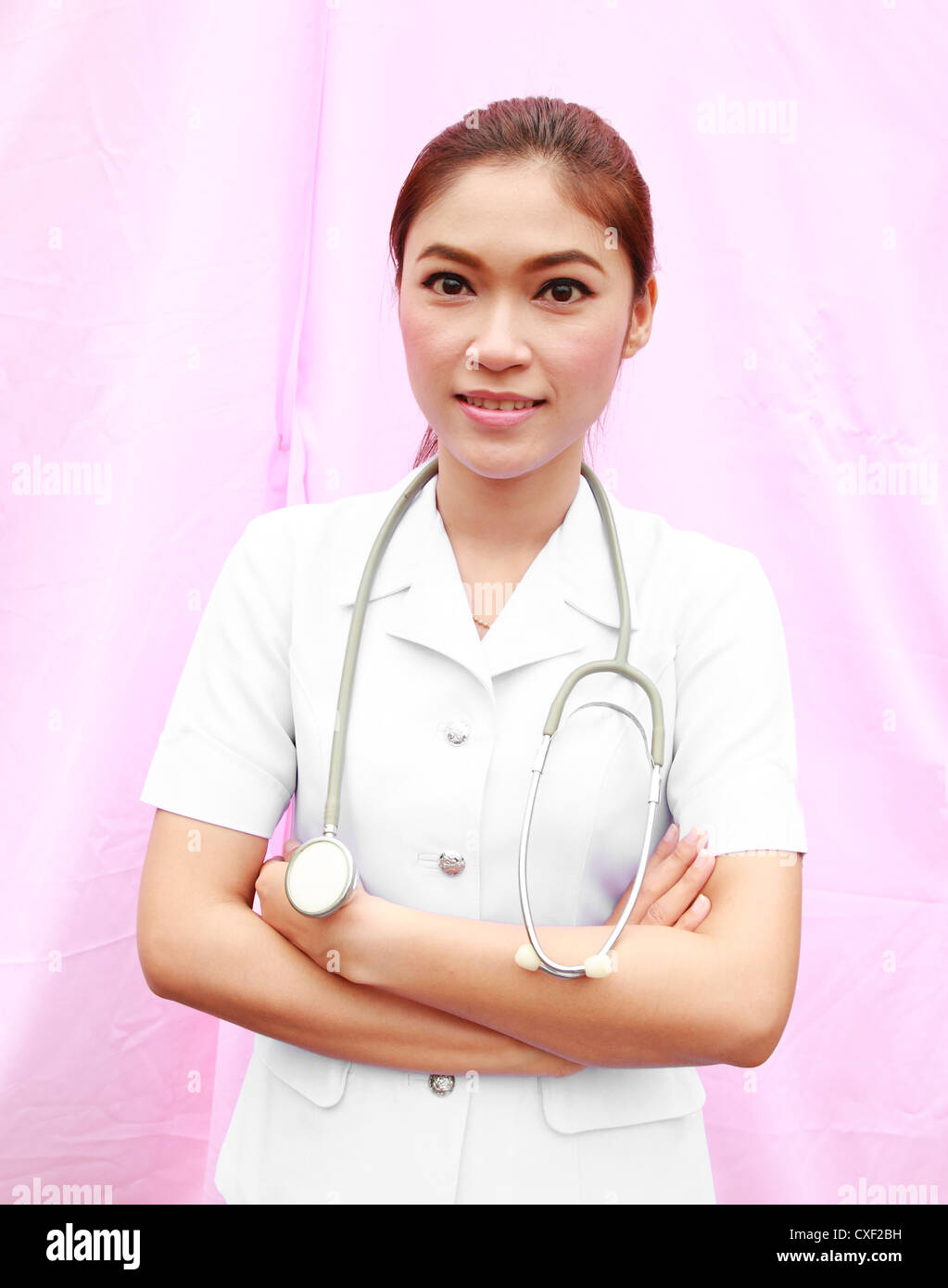 Female nurse standing with stethoscope Stock Photo - Alamy