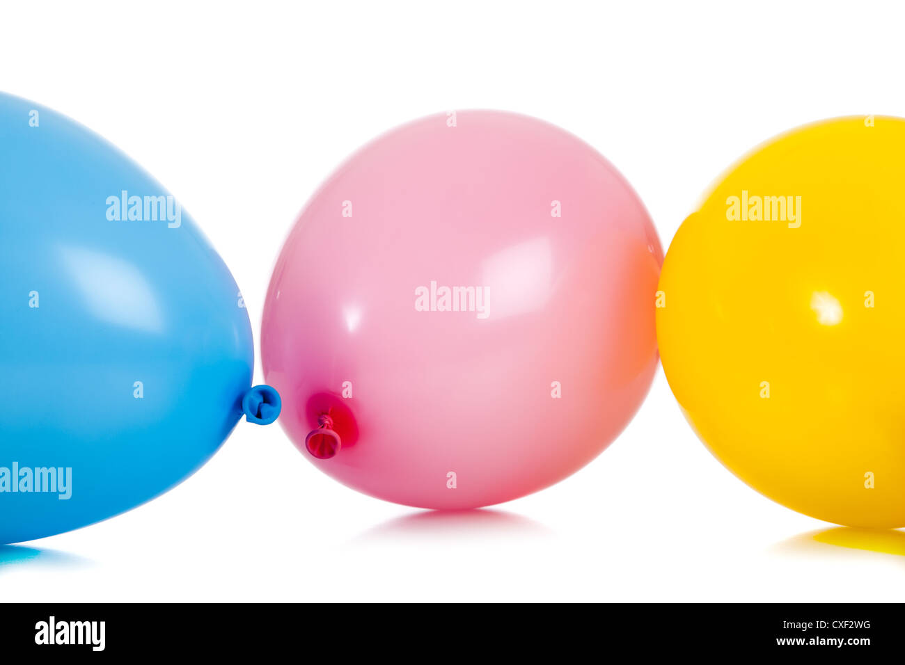 row of balloons on a white background Stock Photo - Alamy