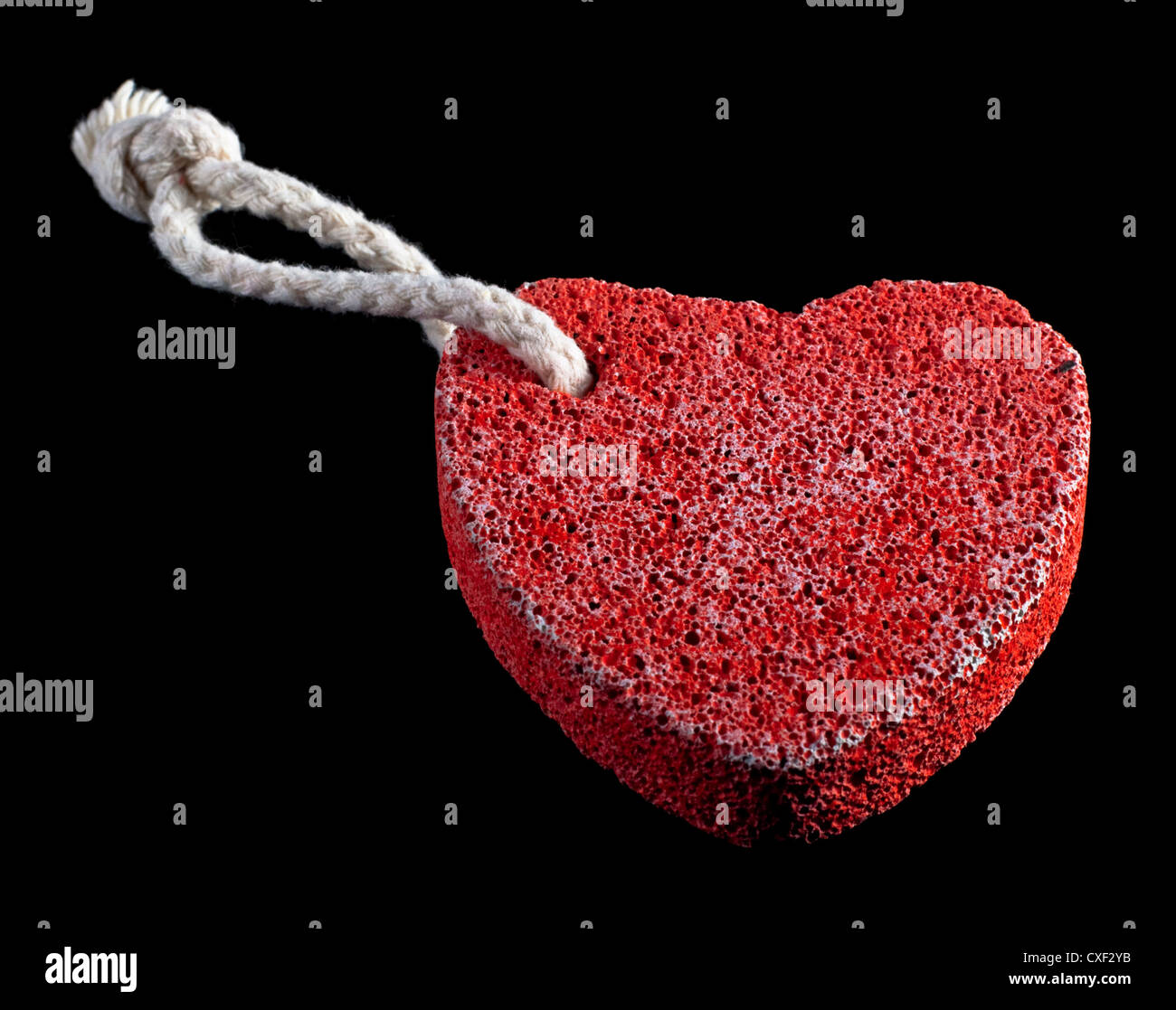 red heart-shaped stone with rope Stock Photo - Alamy