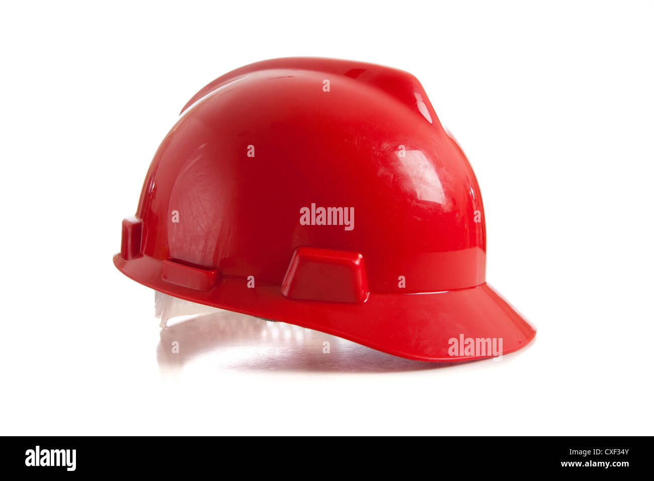 Red hard hat on a white background Stock Photo - Alamy