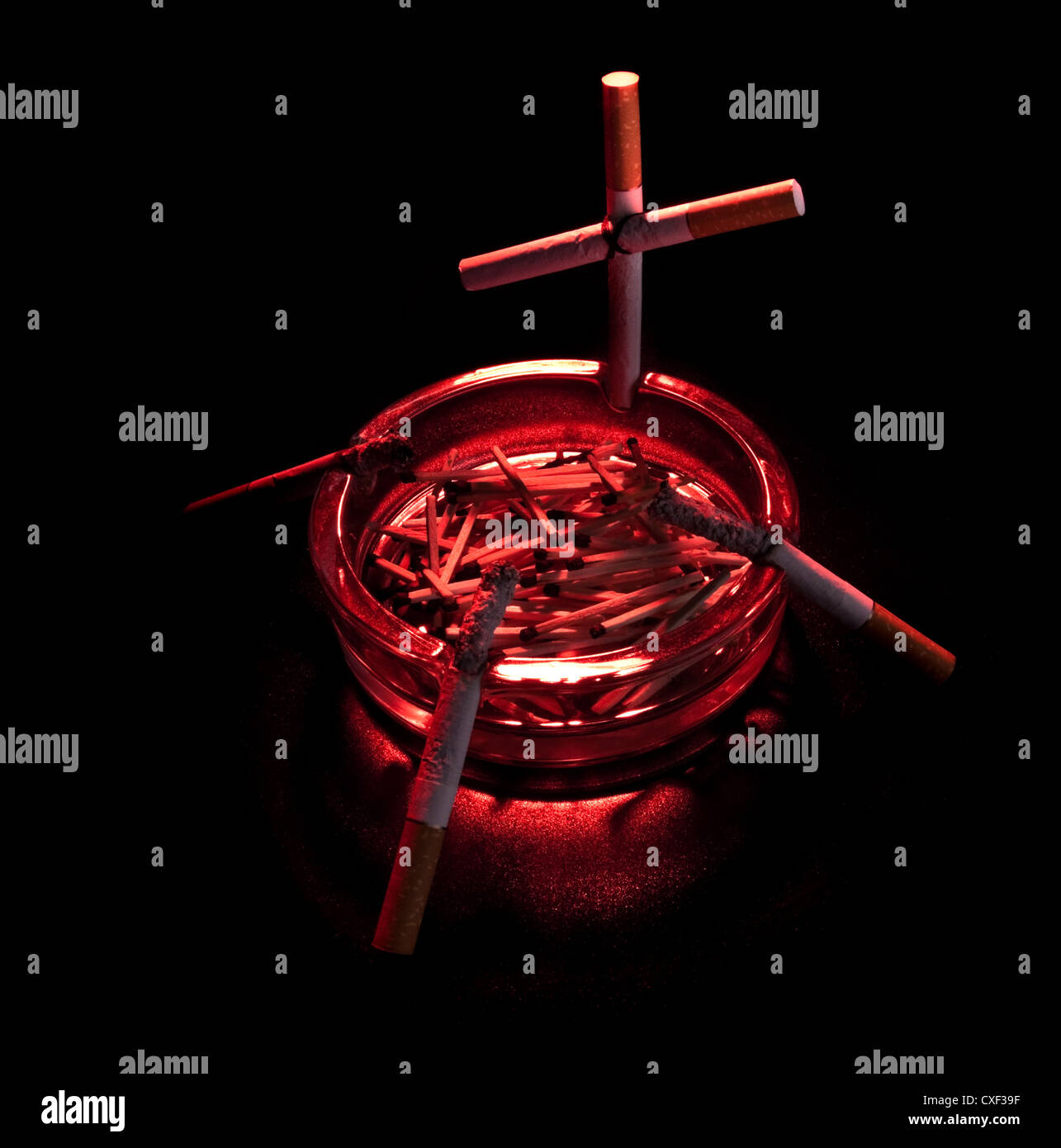 cigarette cross in ashtray Stock Photo - Alamy