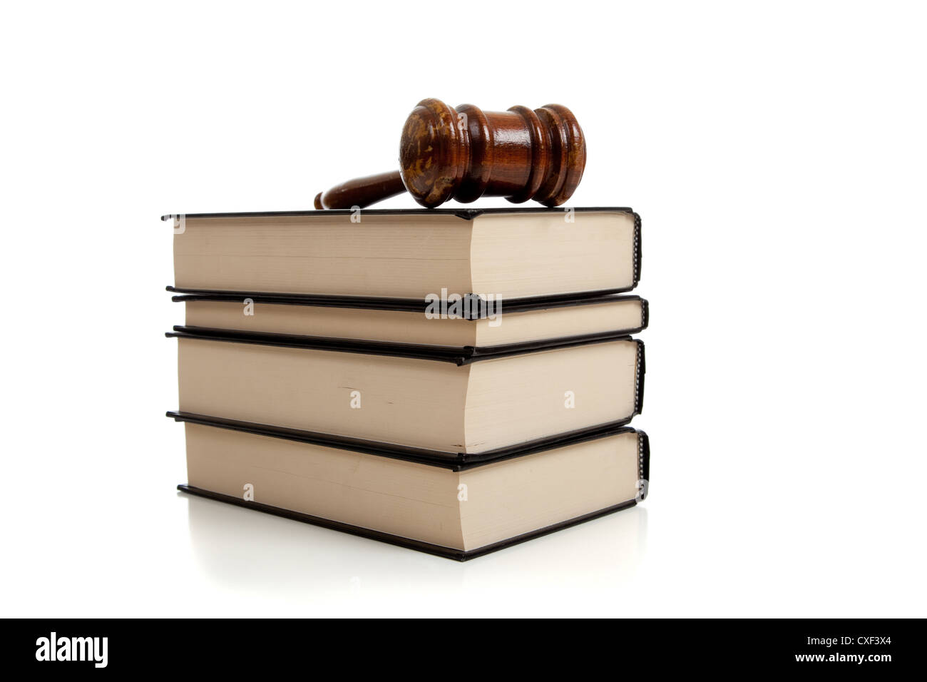 Gavel on a stack of books on a white background Stock Photo - Alamy