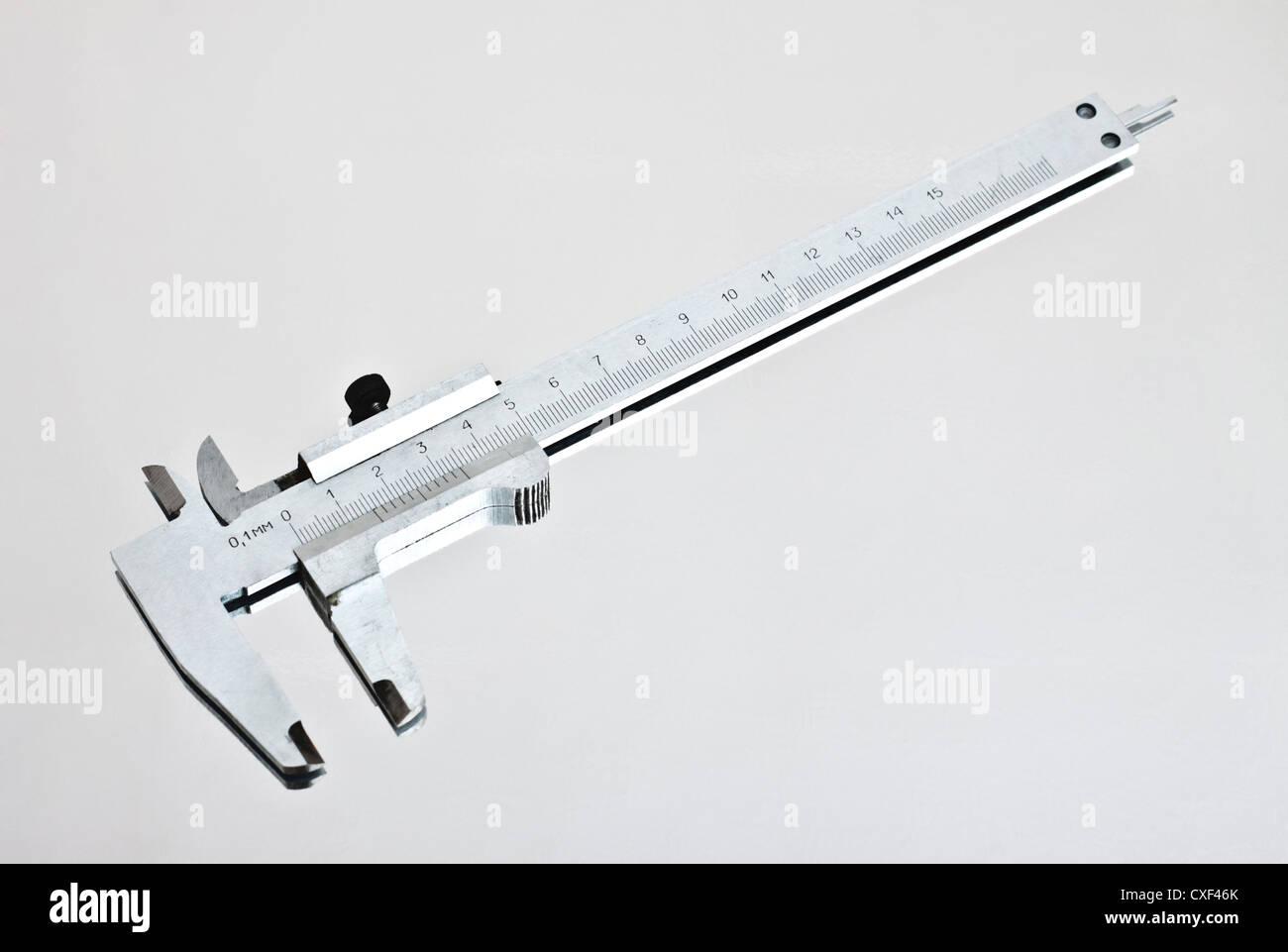 calipers on grey background Stock Photo - Alamy