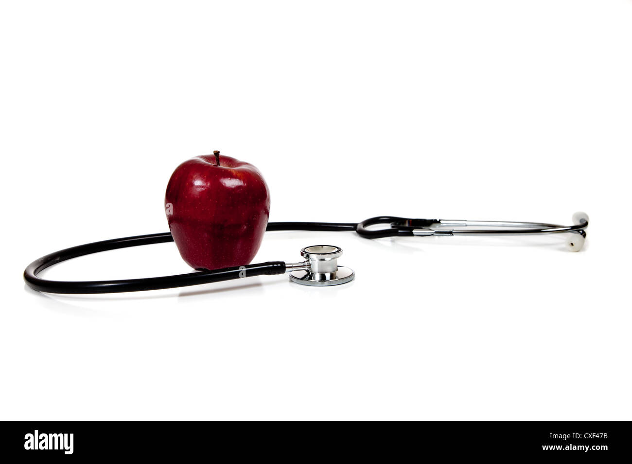 Apple and stethoscope on a white background Stock Photo - Alamy