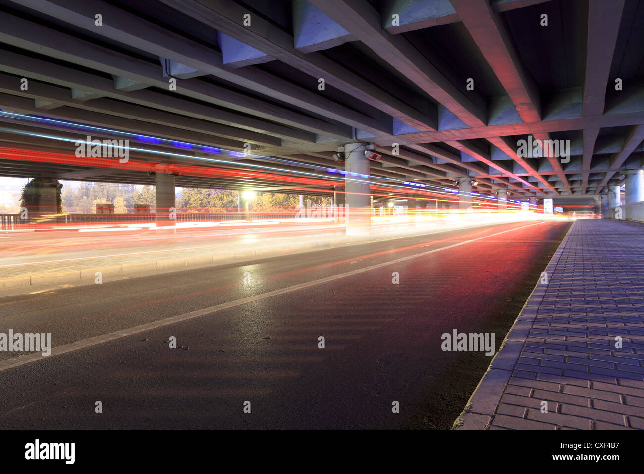 traffic under the viaduct Stock Photo - Alamy