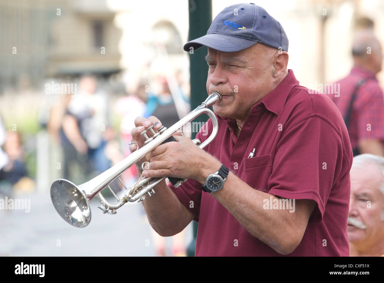 Street Performer playing a trumpet on the streets of Prague Stock Photo ...