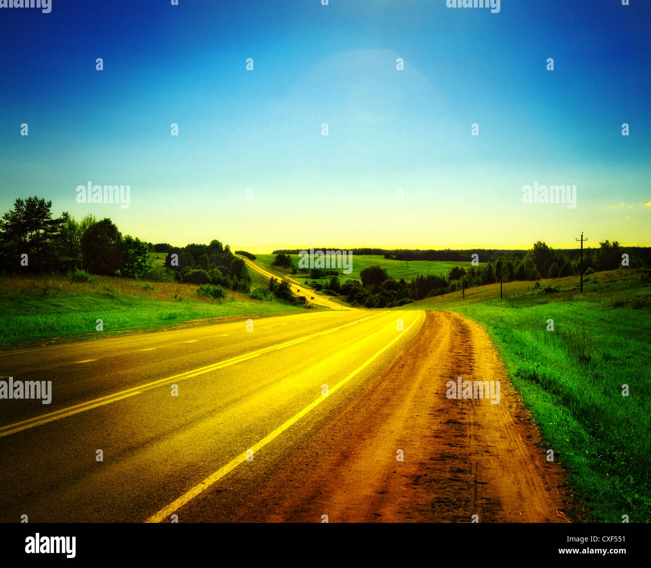 highway under blue sky Stock Photo - Alamy