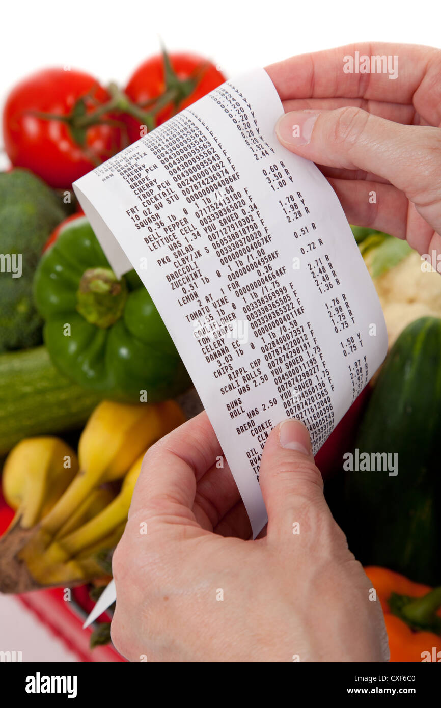 Grocery receipt with fresh vegetables in the background Stock Photo - Alamy