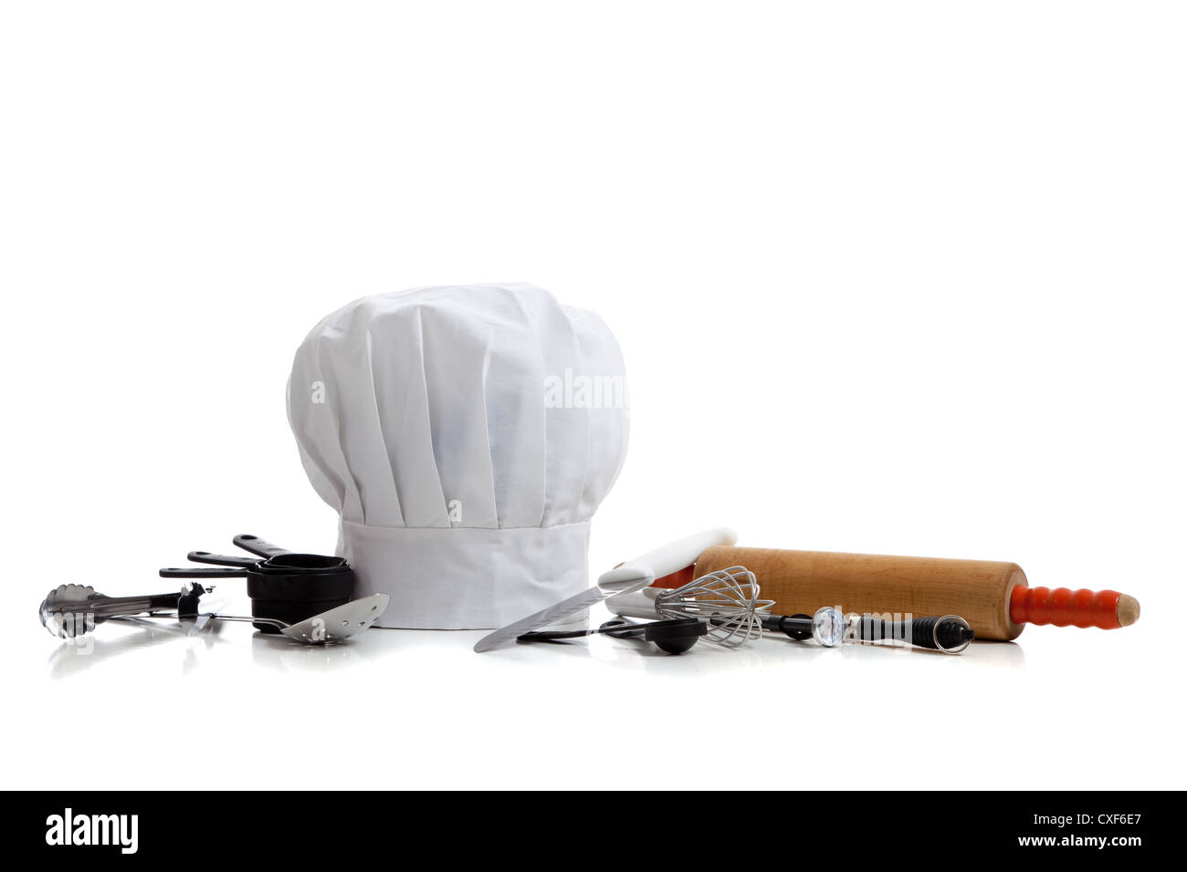 Chef's hat with cooking utensils on a white background Stock Photo - Alamy
