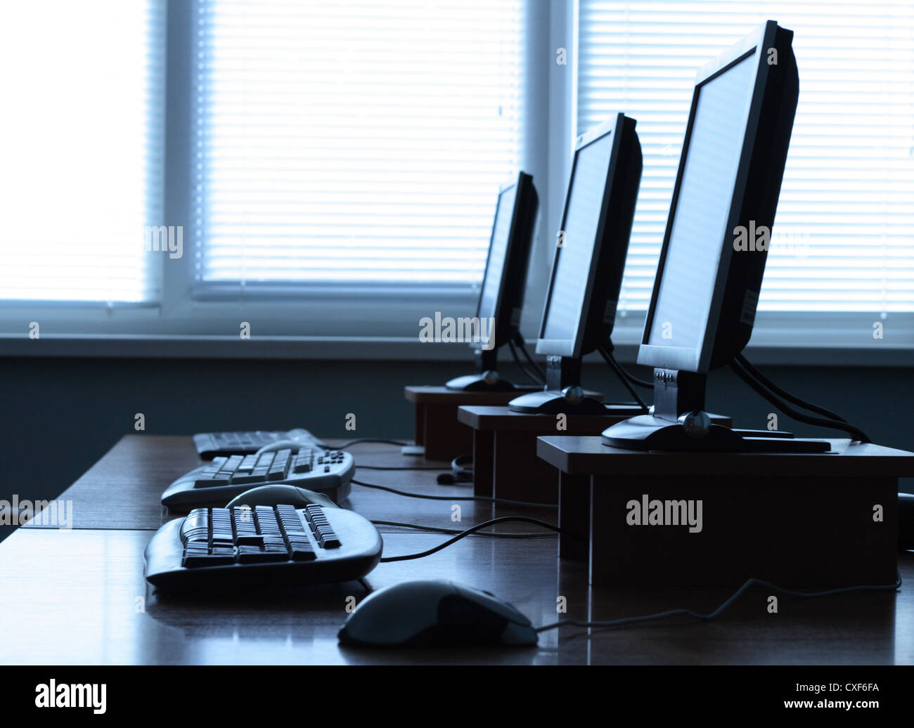 Row of computers in an office Stock Photo - Alamy