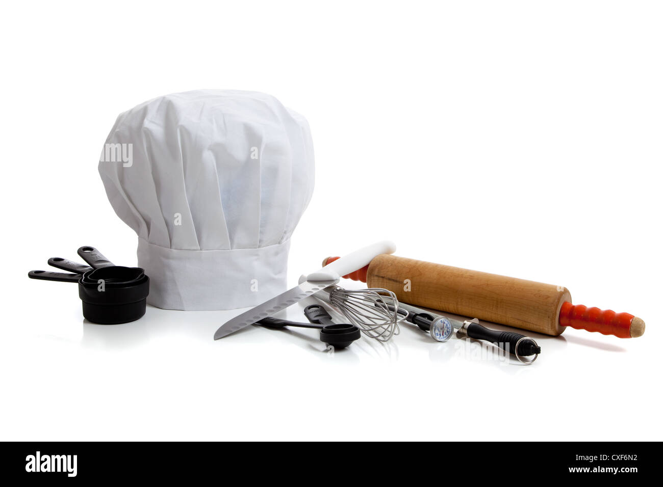 Chef's hat and cooking utensils on a white background Stock Photo - Alamy