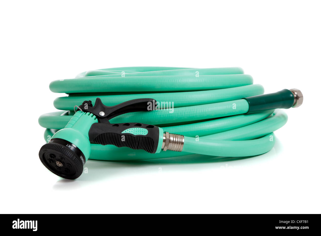 Green garden hose on a white background Stock Photo - Alamy