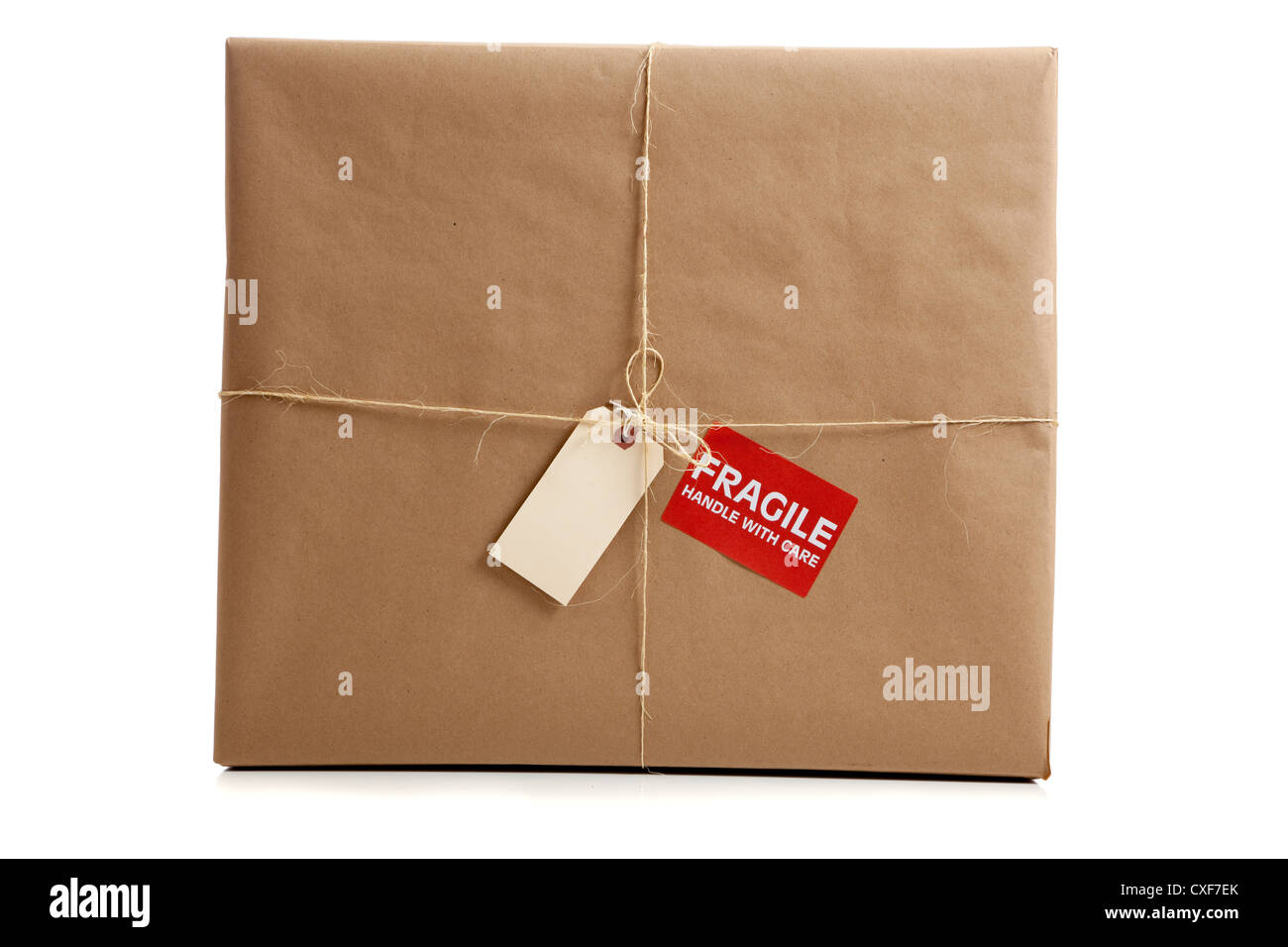 Brown wrapped box with fragile sticker and twine Stock Photo - Alamy