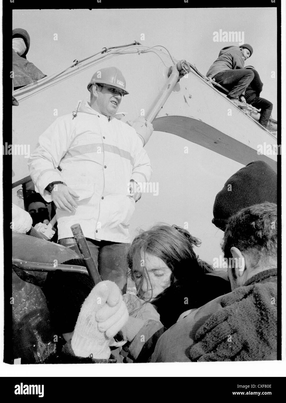 Group 4 security trying to prevent a protester from accessing earth ...