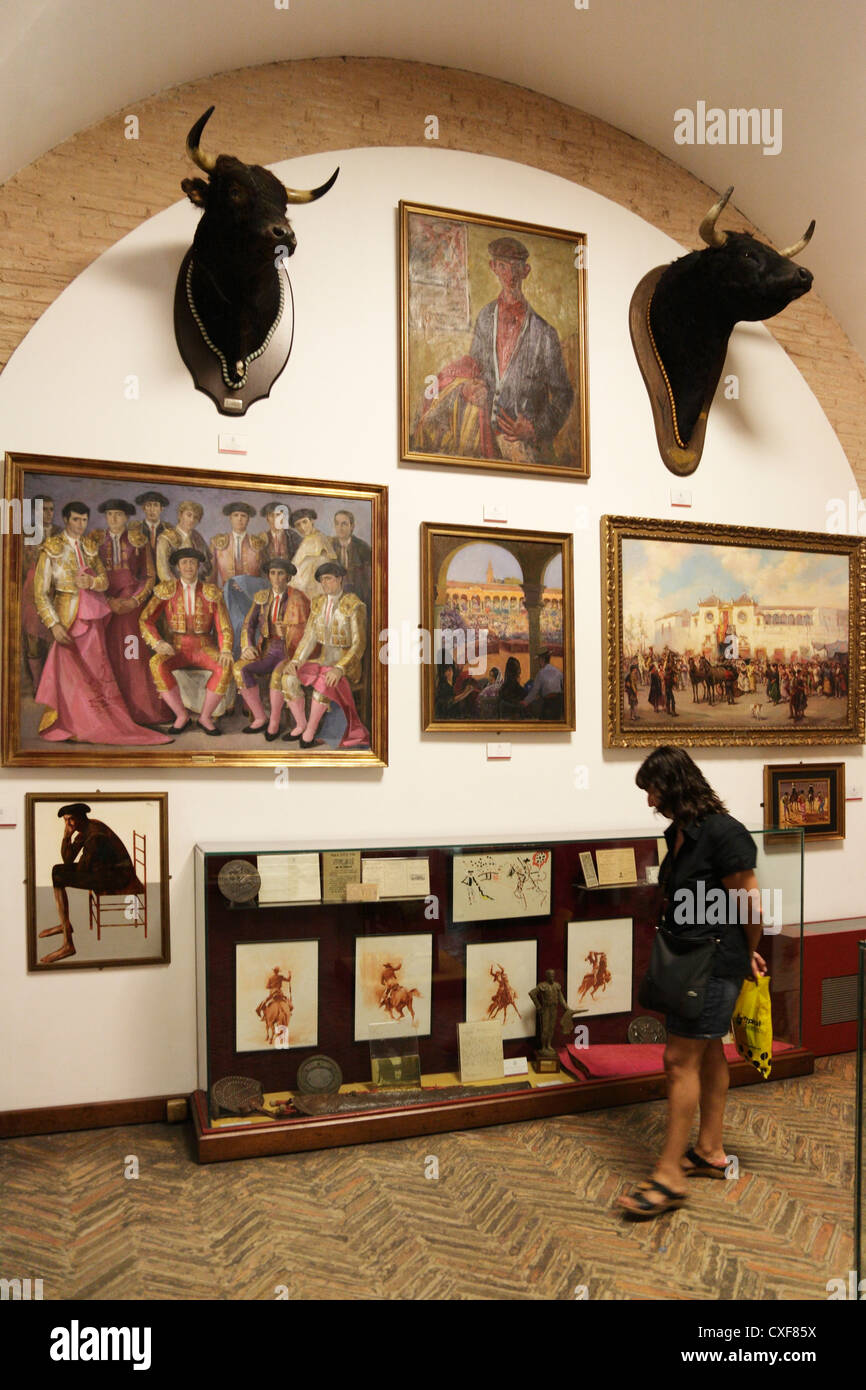 Woman tourist in the Museum of bullfighting Plaza de toros Seville ...