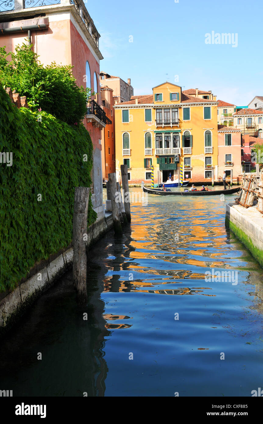 Colorful architecture reflected in canal in Venice, Italy Stock Photo ...
