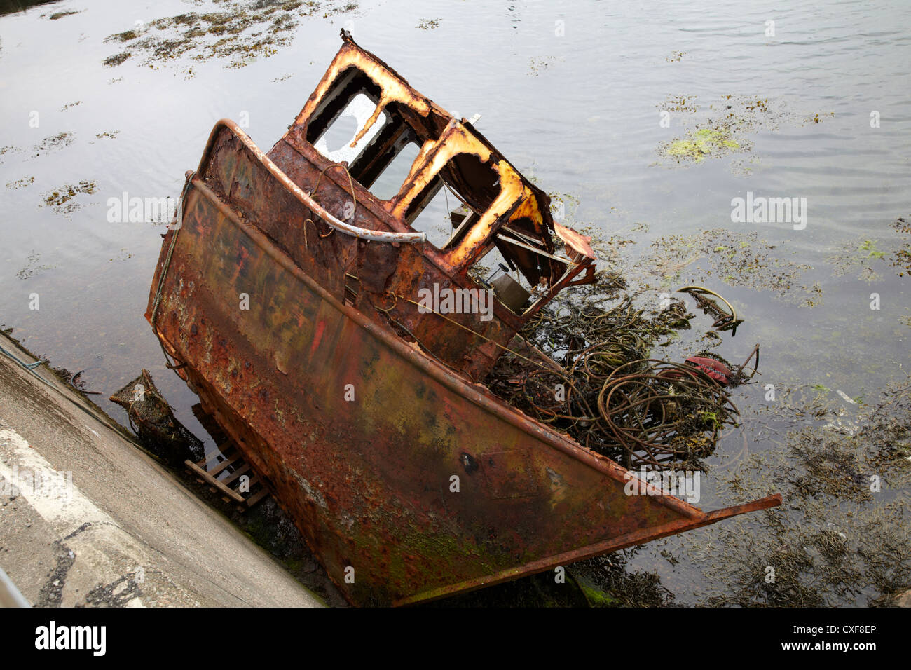 Derelict and rusting fishing boat at Cuan ferry Harbour Stock Photo - Alamy