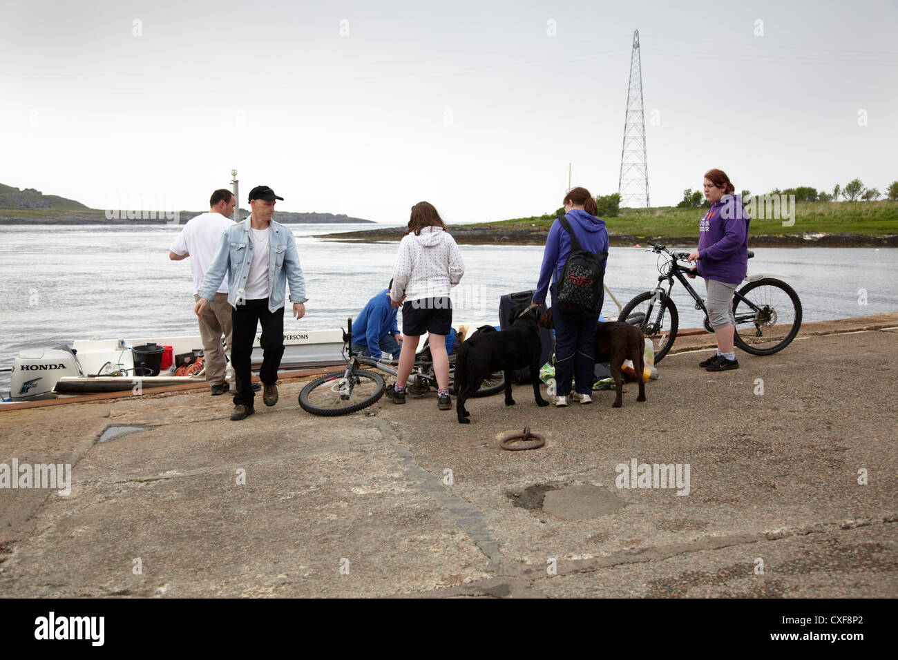 Group of teenagers waiting to board the Cuan ferry to Luing Stock Photo ...