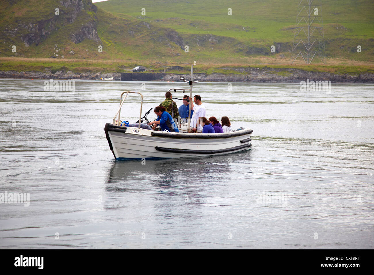 Ferry from Cuan Ferry leaving with pedestrians and cyclists crossing ...