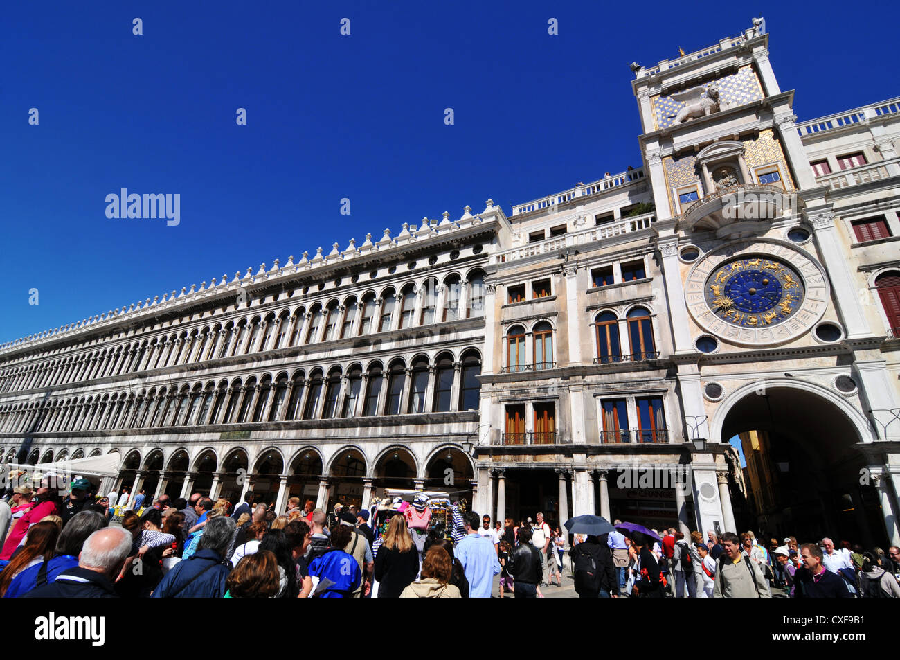 Venice, Italy - 6 May, 2012: Tourists visiting the St. Marc Clock Tower ...
