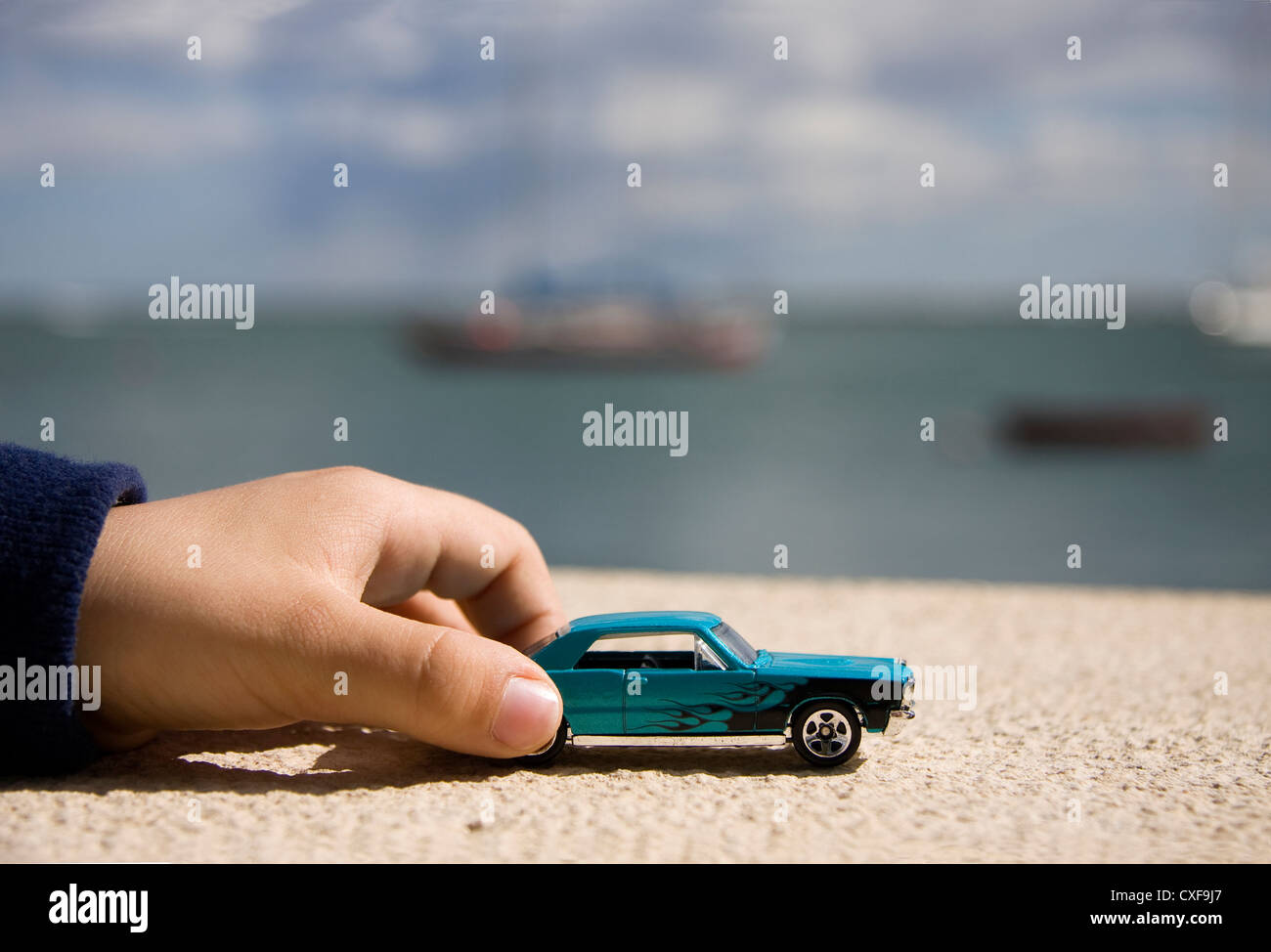 Close-up of a kid hand playing with classic car Stock Photo - Alamy