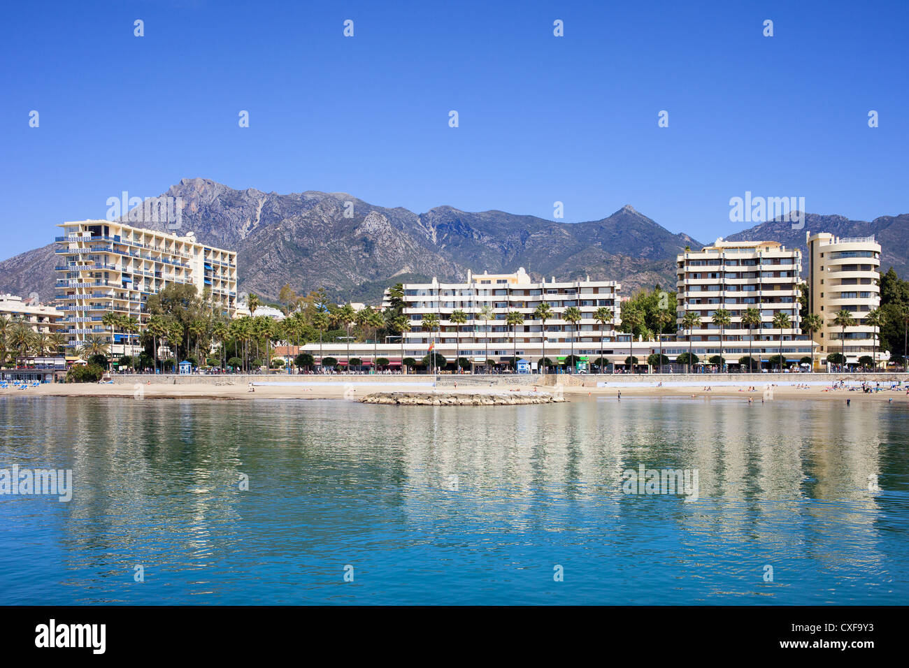 Apartment buildings by Mediterranean Sea in resort town of Marbella on ...