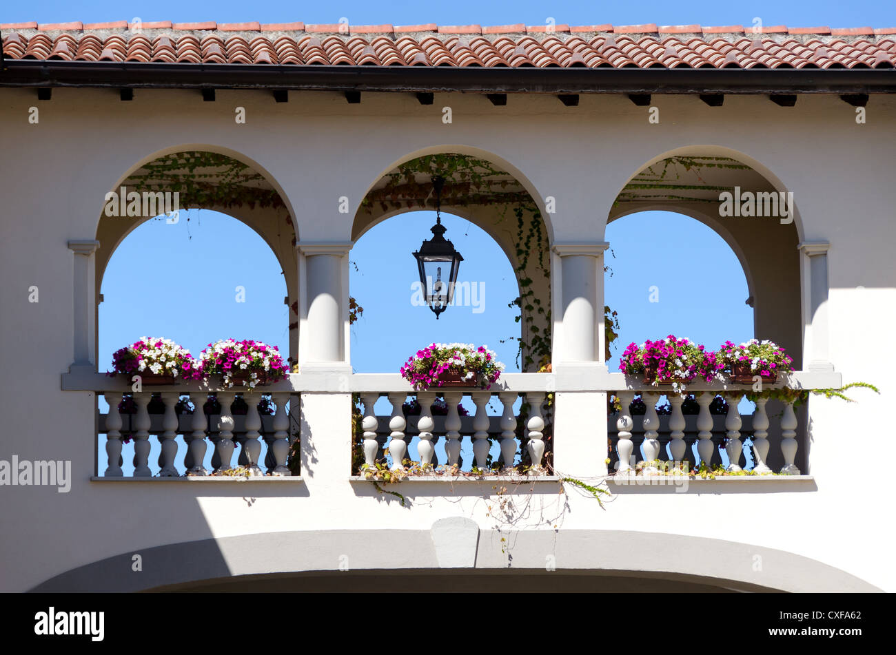 three arches with flower and lamp Stock Photo - Alamy