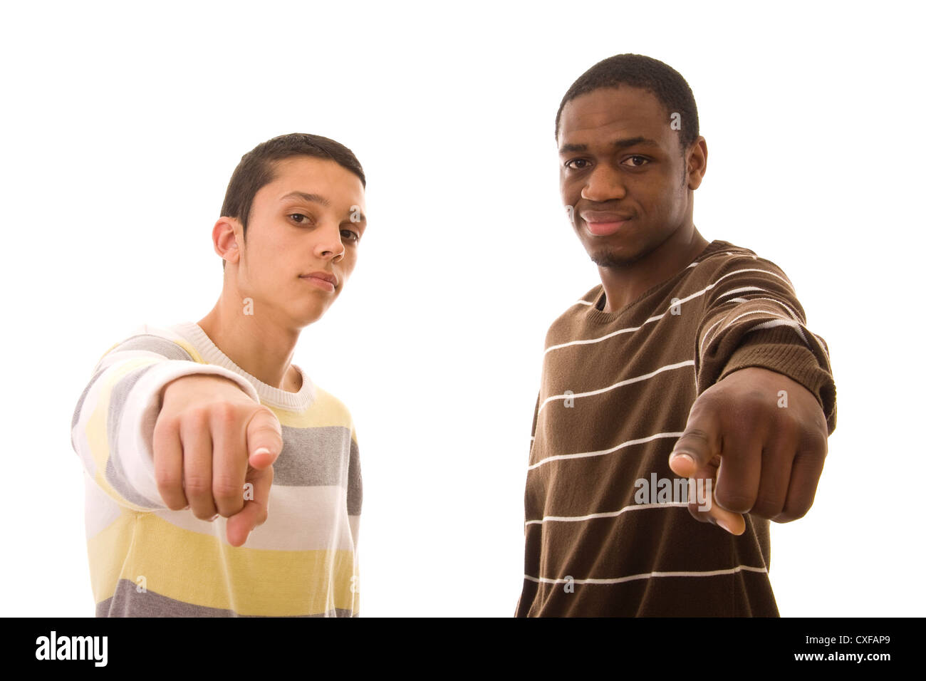 Two young men pointing to you isolated on white Stock Photo - Alamy