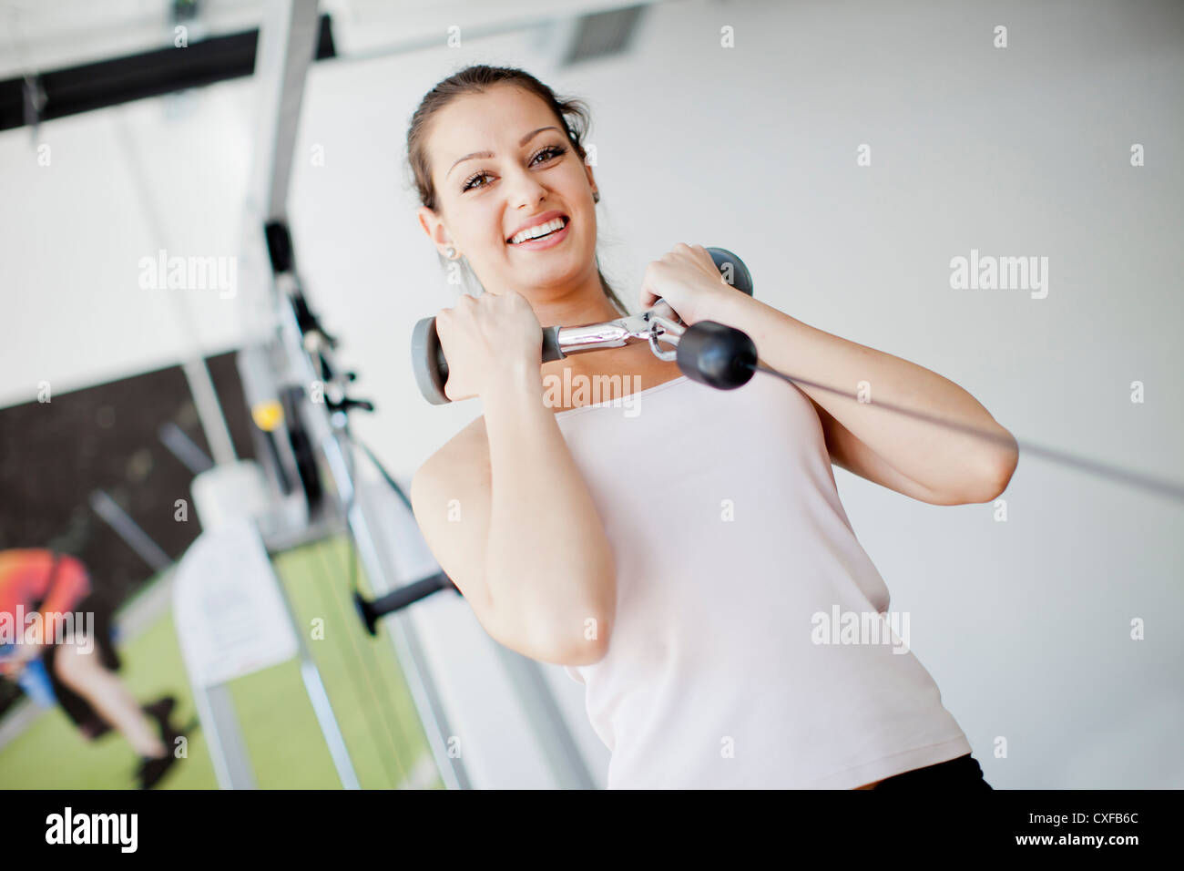 Young girl training in the gym Stock Photo - Alamy