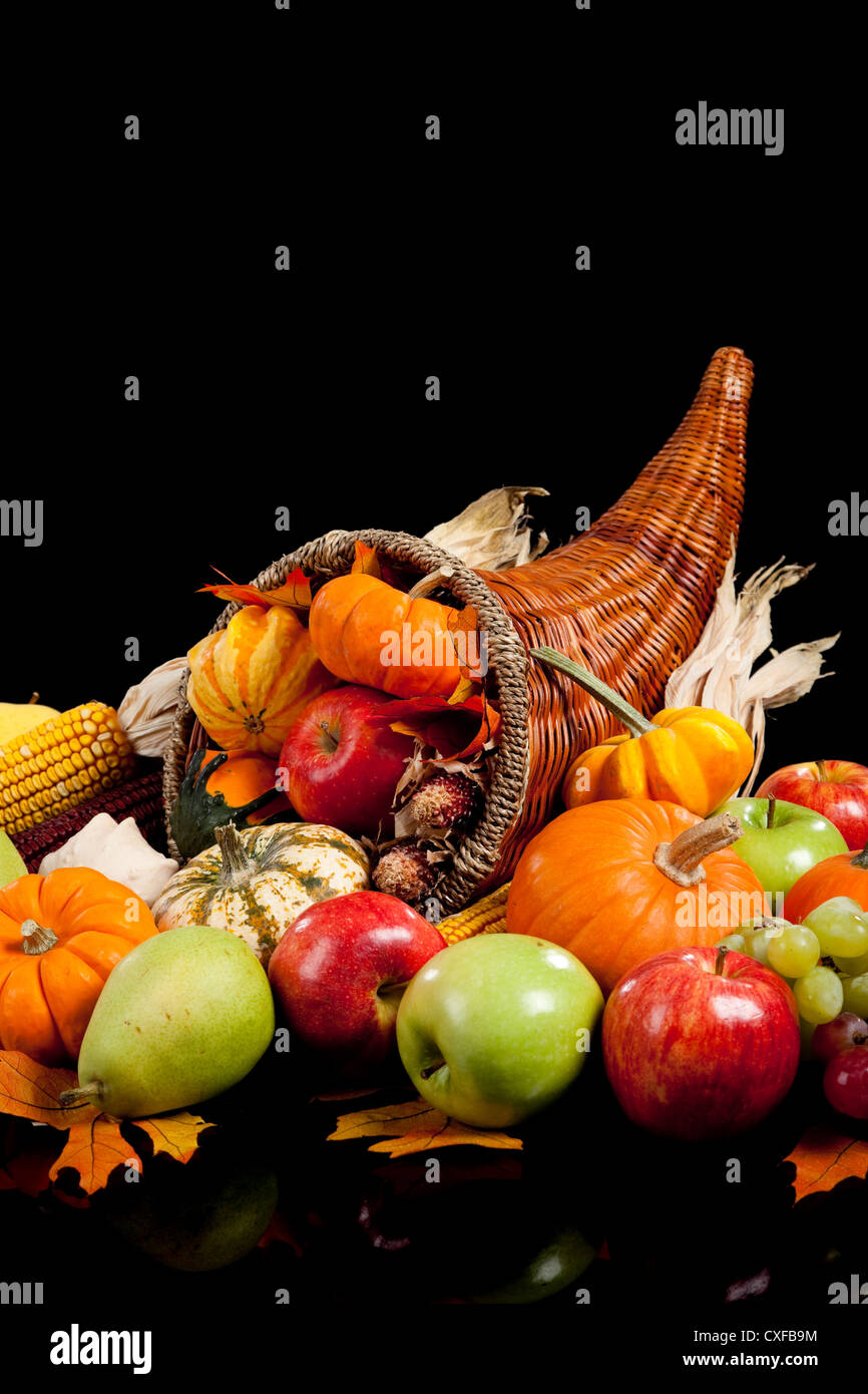 Full cornucopia on a black background Stock Photo - Alamy