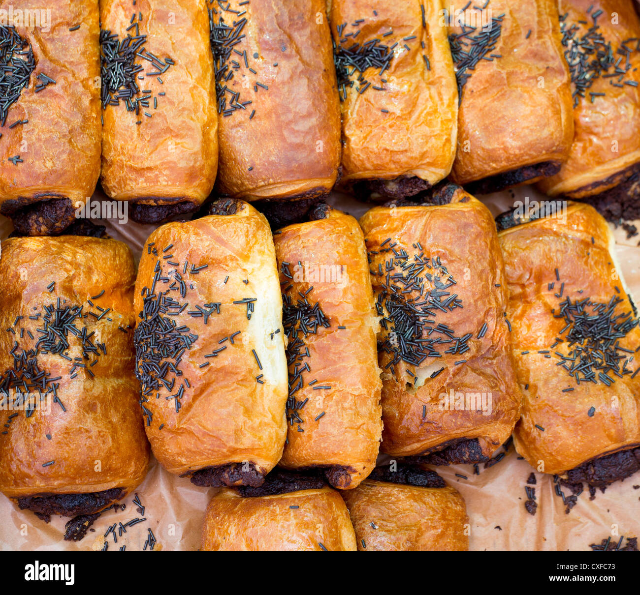Bakery Croissant Neapolitan chocolate cakes in a row Stock Photo - Alamy