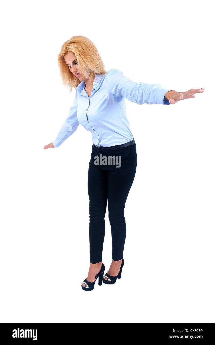 Isolated young business woman walking rope Stock Photo - Alamy