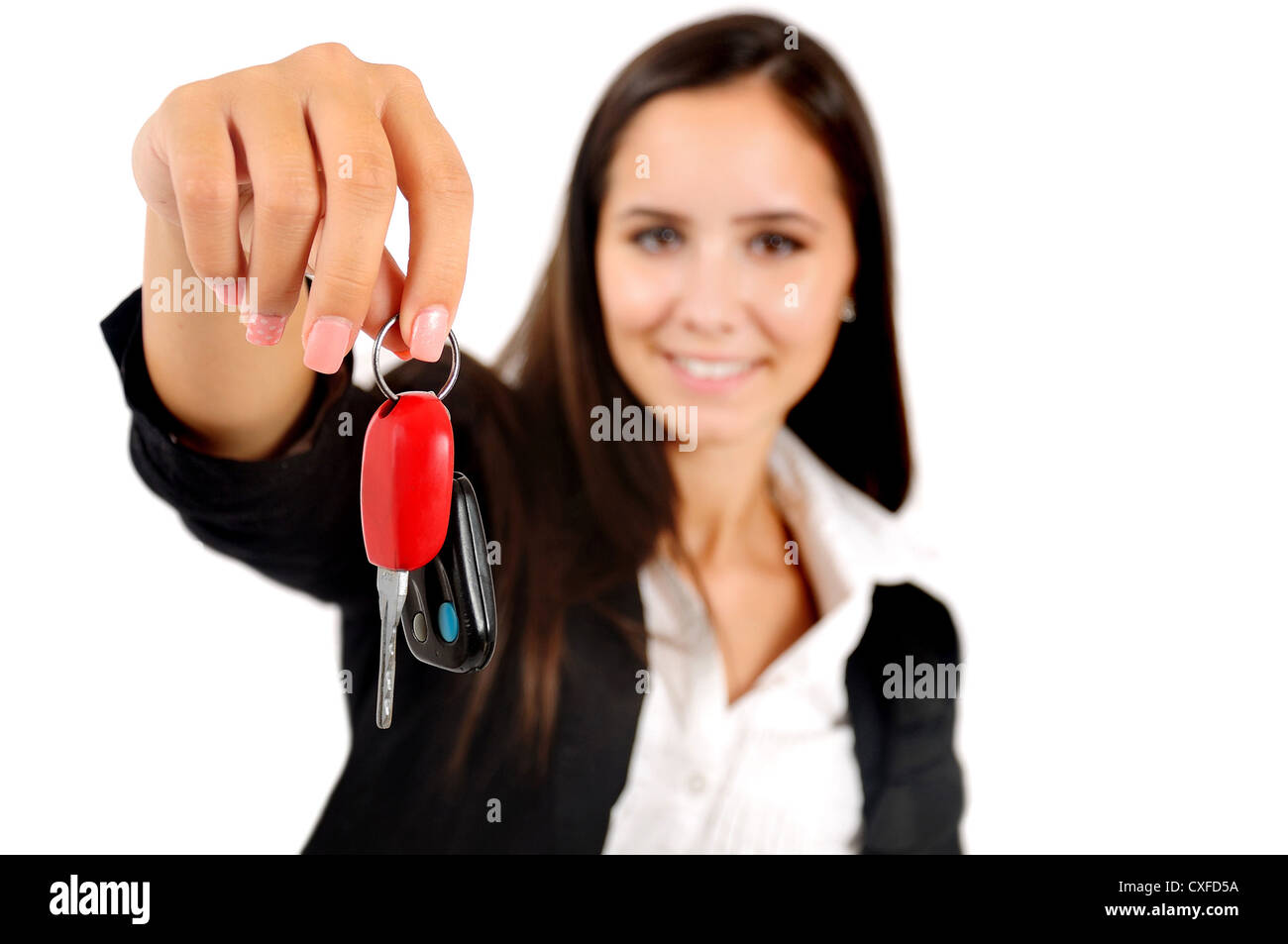 Isolated young business woman showing car key Stock Photo - Alamy