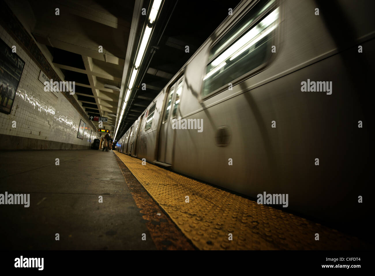Subway train arriving at a station in New York City Stock Photo - Alamy
