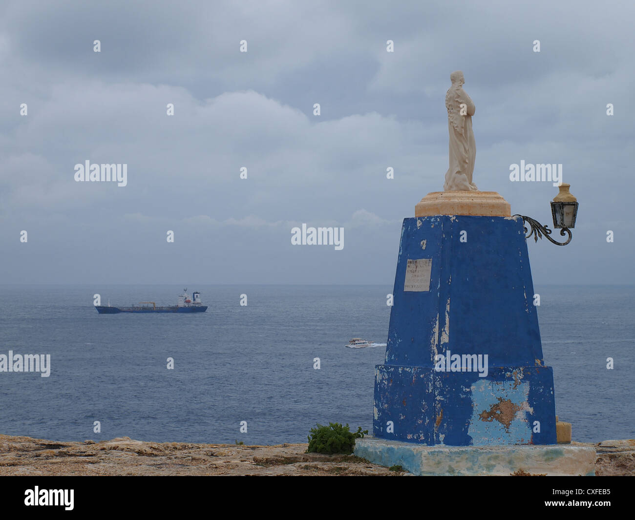A close up of an old statue on a cliff Stock Photo - Alamy