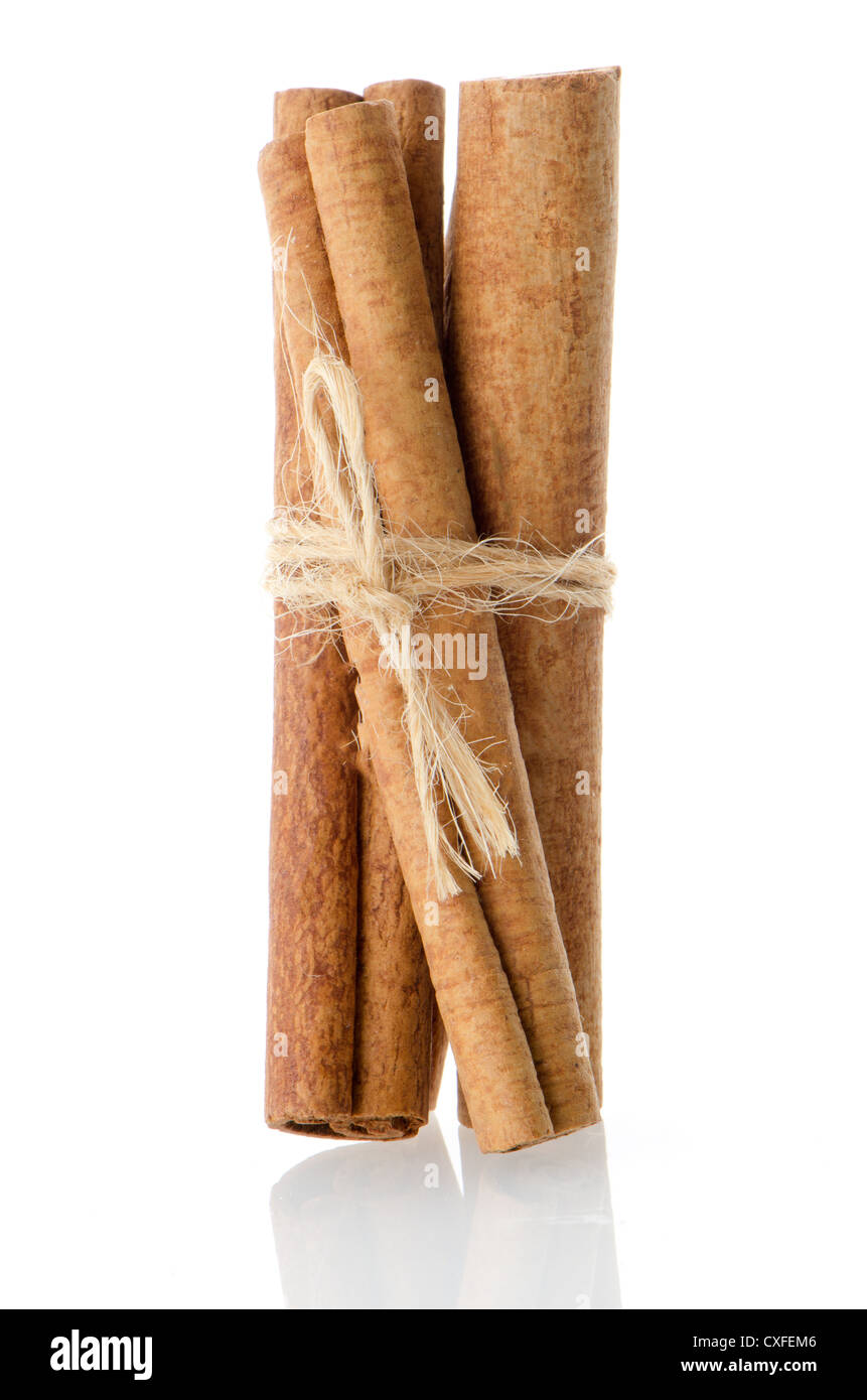 Cinnamon sticks, tied by rope on white reflective background Stock ...