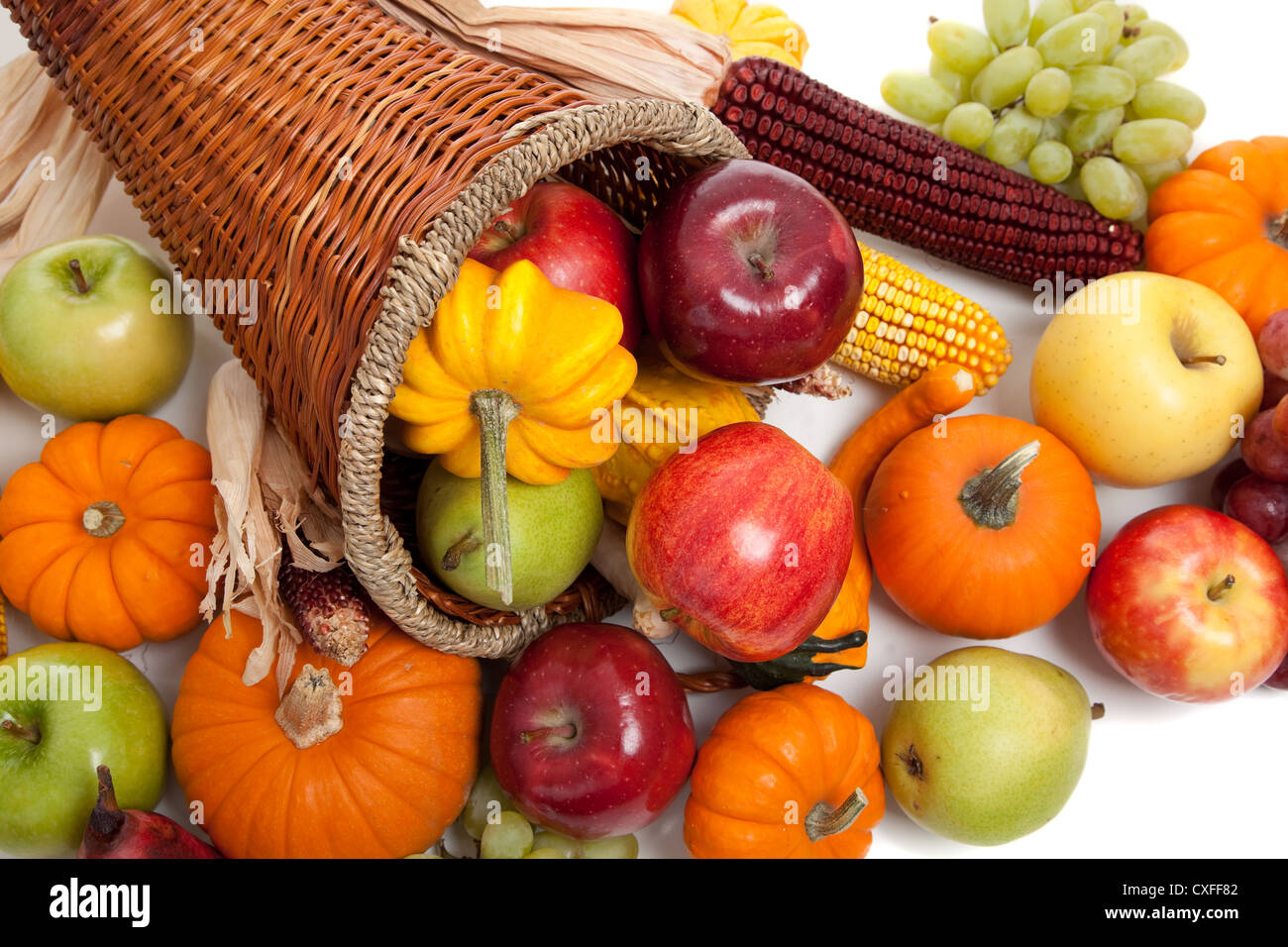 Cornucopia full of fruit and gourds Stock Photo - Alamy