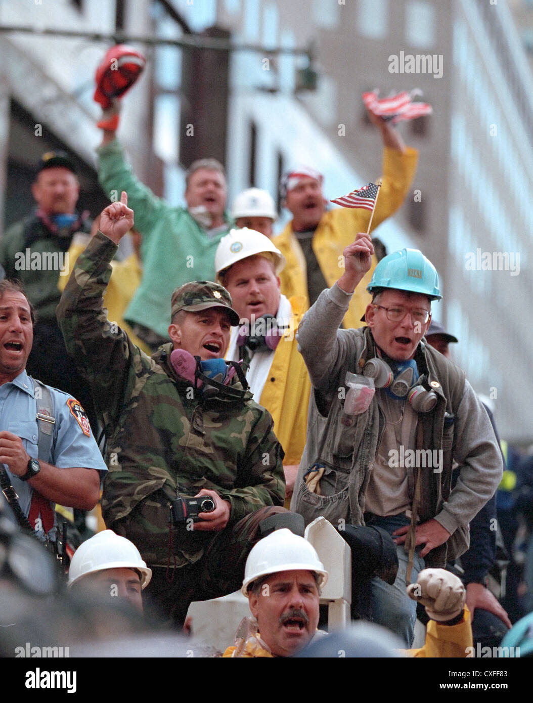Rescue workers cheer as US President George W. Bush addresses rescue ...