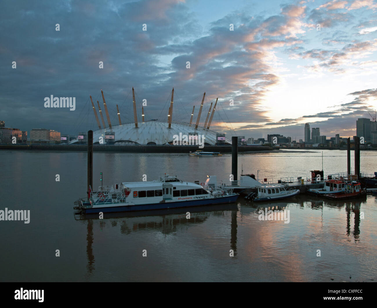Sunset view of the 02 Arena showing River Thames and Thames Clippers ...