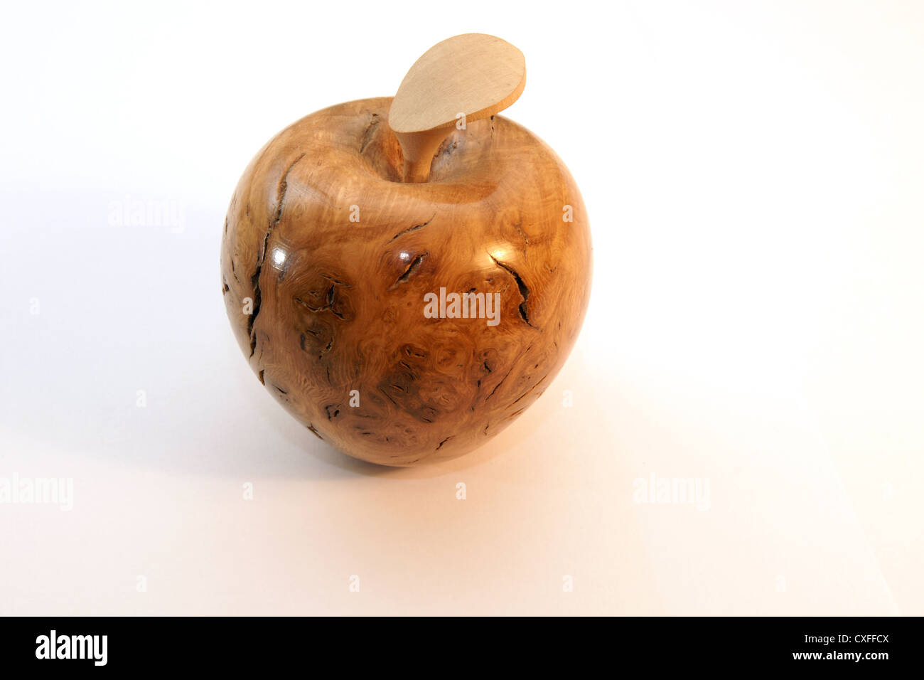 A decorative wooden apple made on a wood turning lathe Stock Photo - Alamy